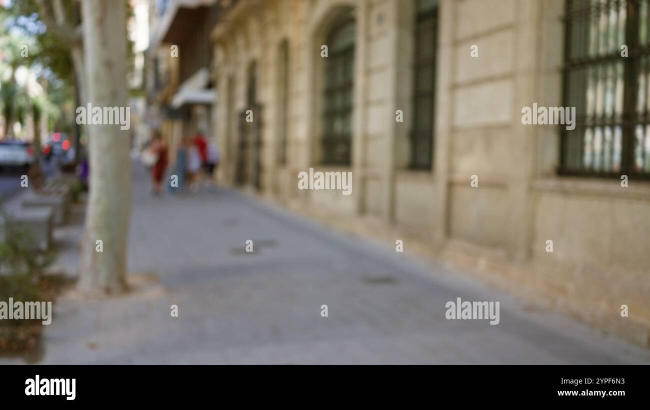 Blurred city street scene with people walking near historic building on ...