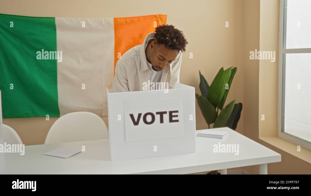 Young african american man voting indoors in front of an irish flag at ...