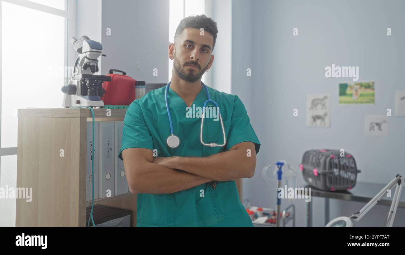 Handsome young hispanic man in green scrubs with arms crossed in a ...