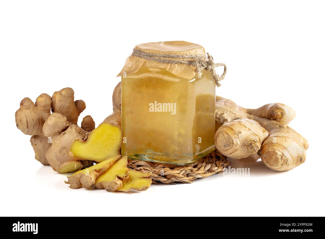 Ginger jam in small square jar and fresh ginger isolated on a white ...