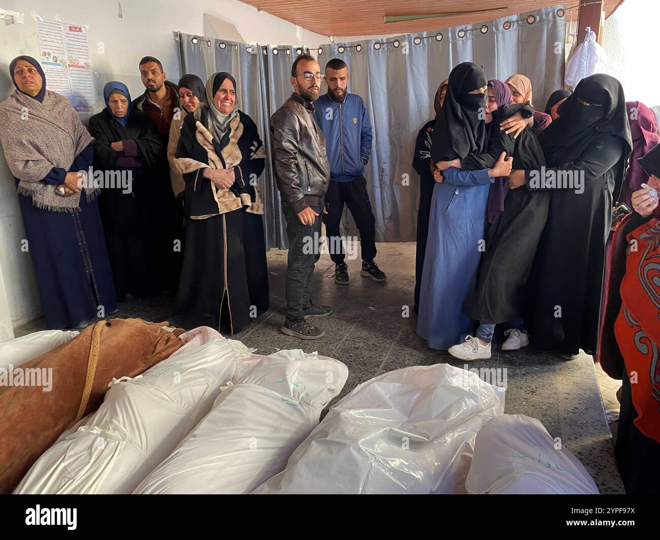 Relatives and loved of Palestinians, who died in Israeli attacks on the ...