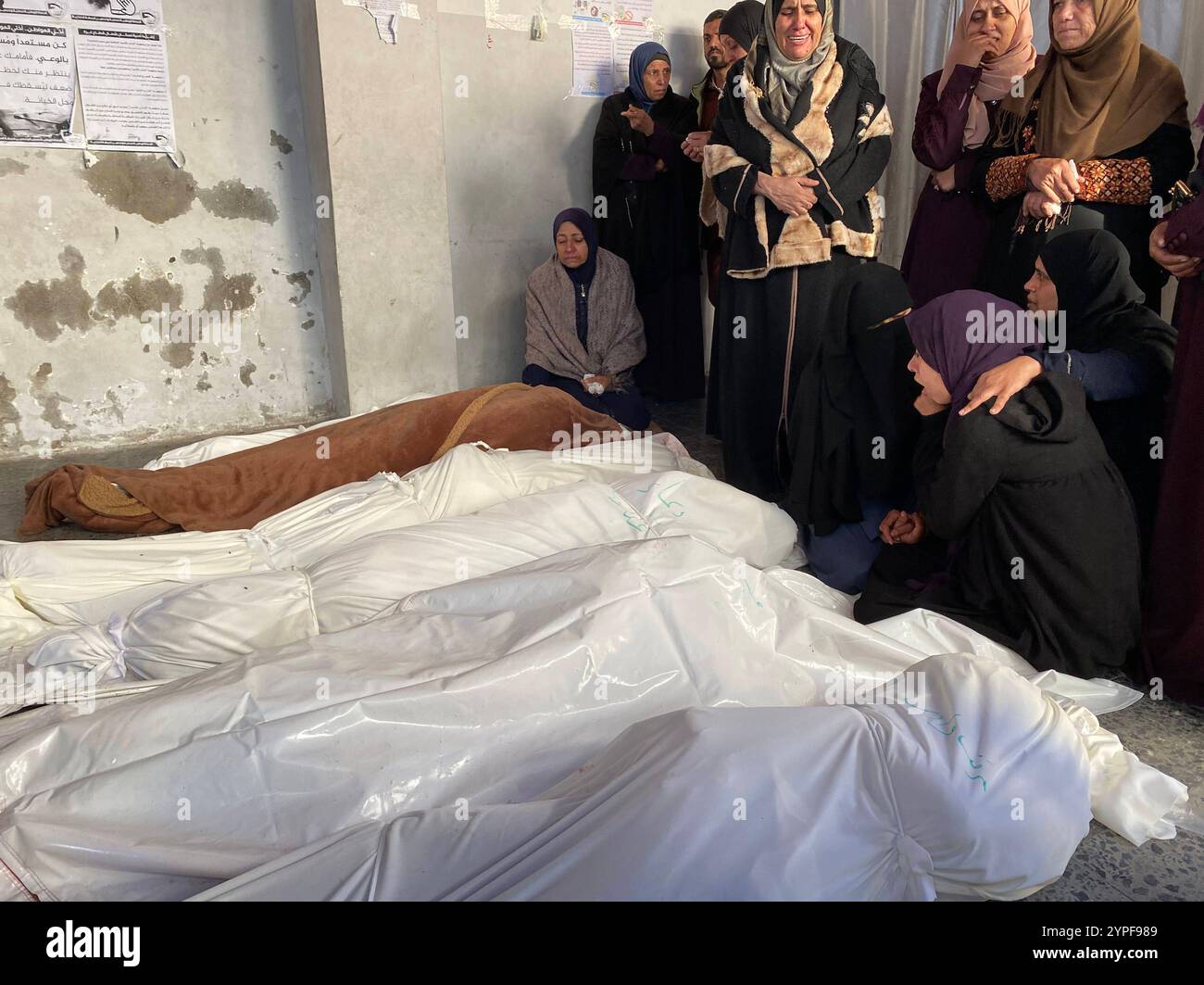 Relatives and loved of Palestinians, who died in Israeli attacks on the ...