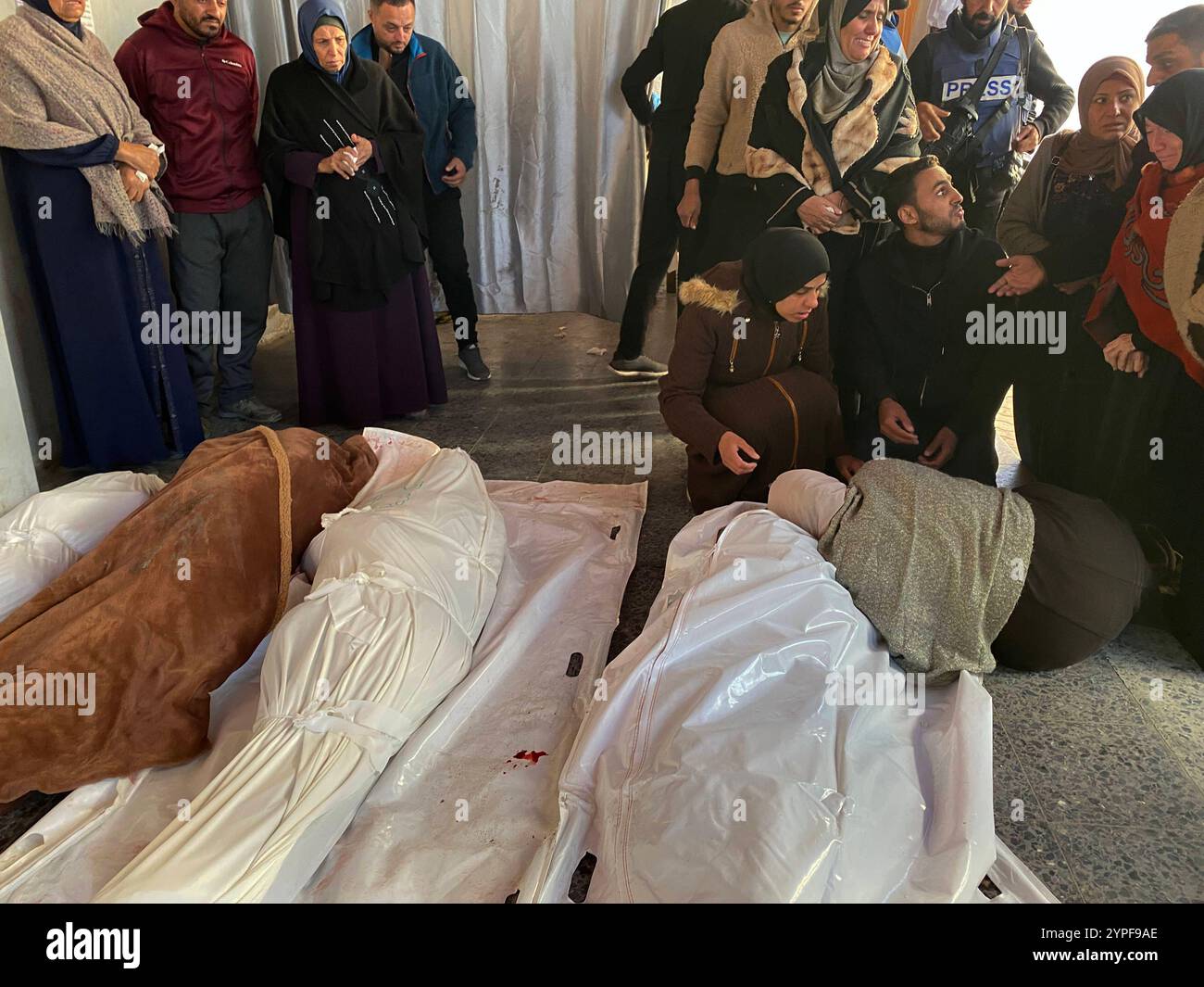 Relatives and loved of Palestinians, who died in Israeli attacks on the ...