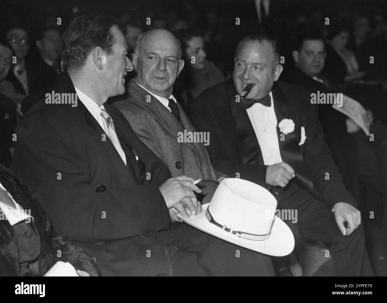 American Film Star JOHN WAYNE with producer HERBERT J. YATES and ...
