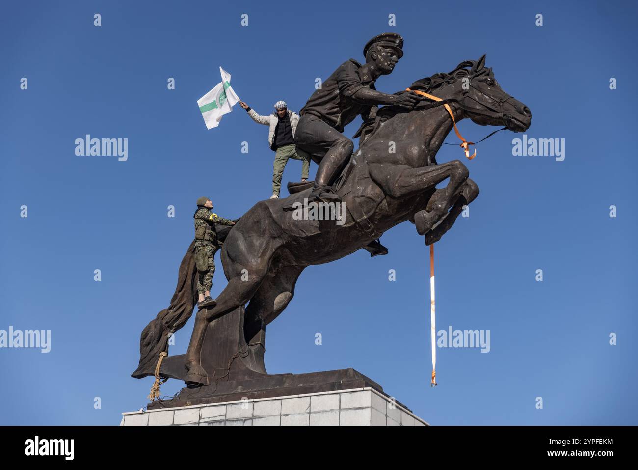 Aleppo, Syria. 30th Nov, 2024. A Syrian armed opposition fighter raises ...