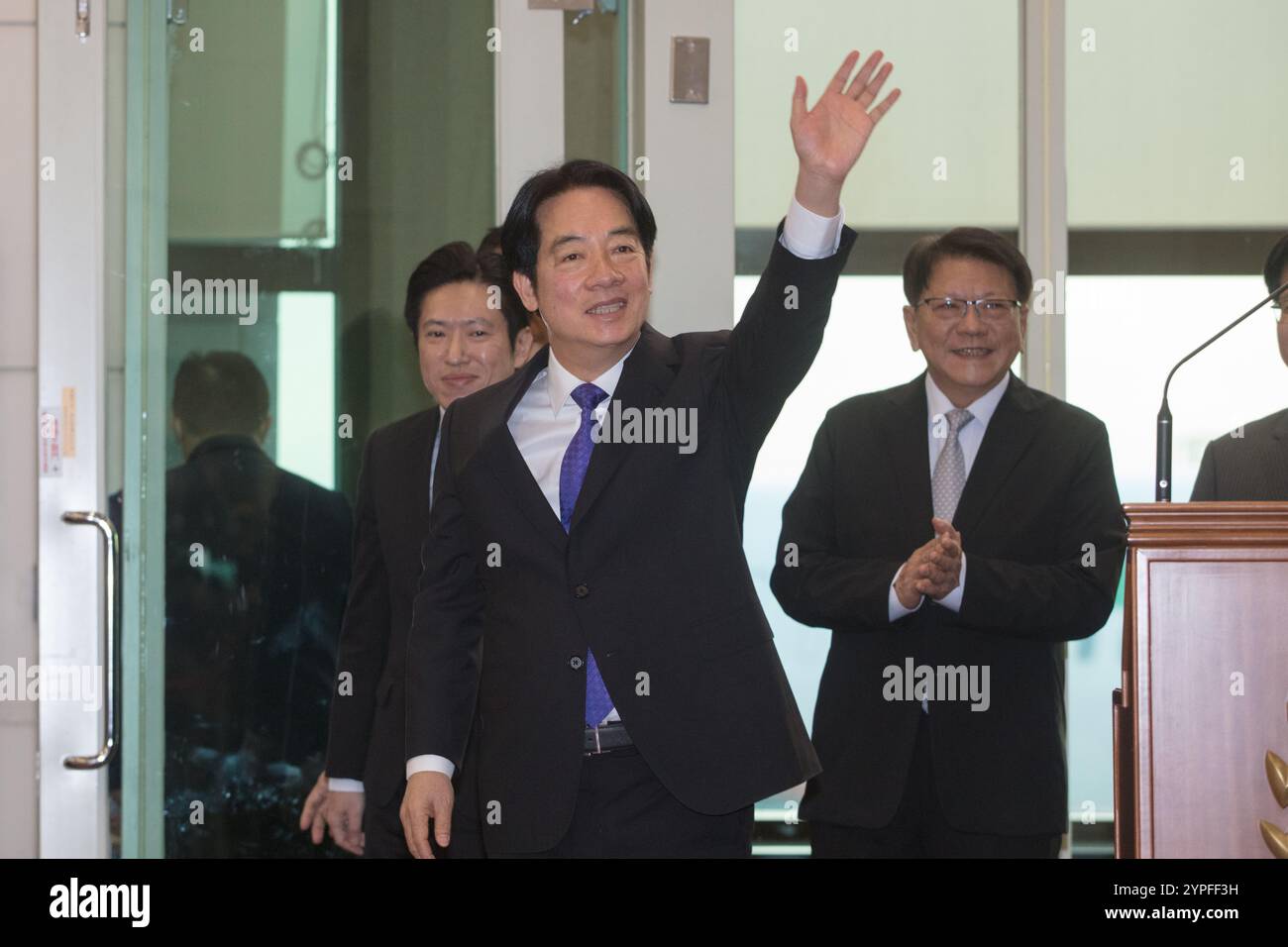 Tiwanese President Lai Ching-te waves to the media as he departs for a ...