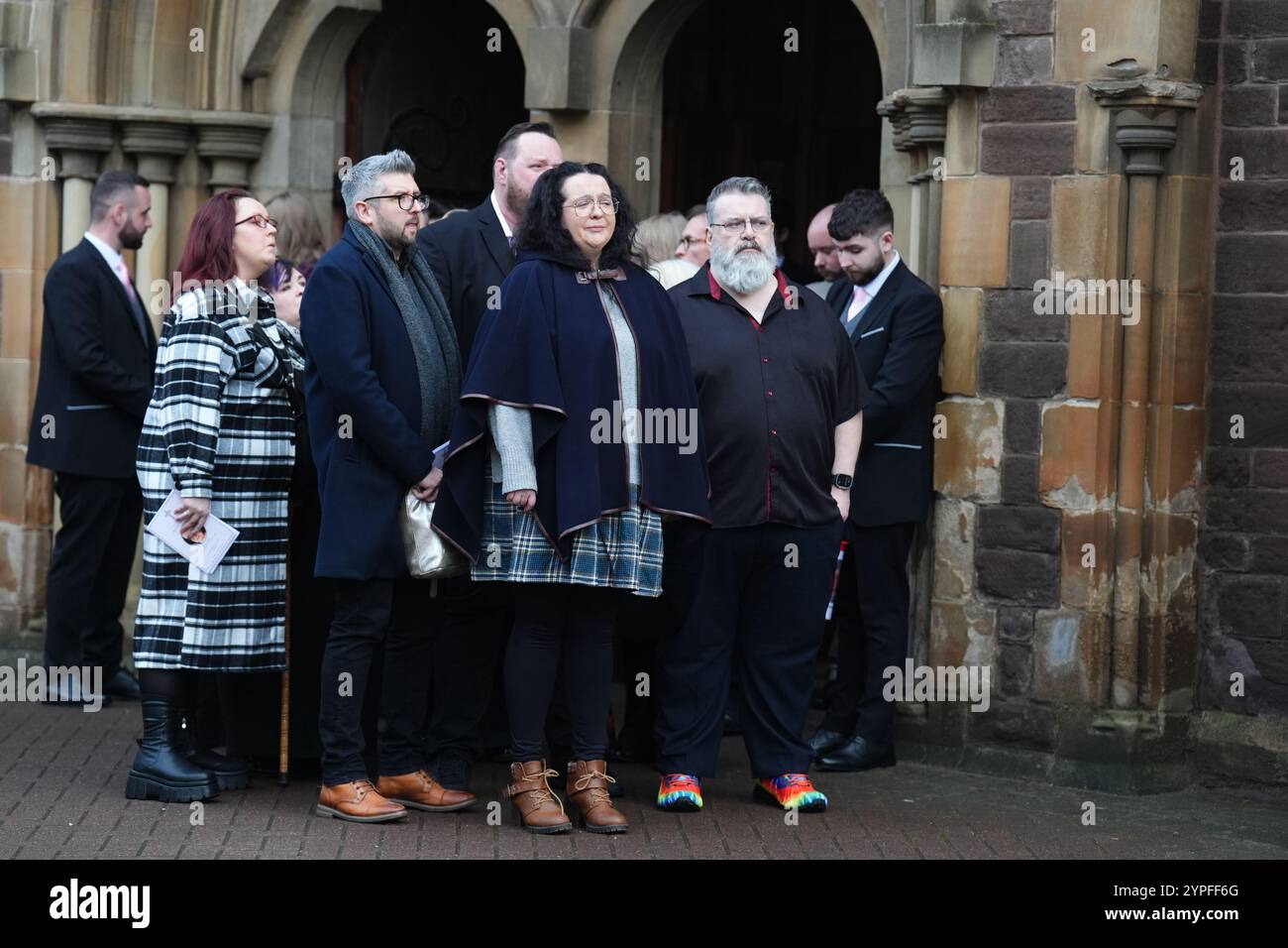 Ashley Storrie (centre) following the funeral of her mother and ...