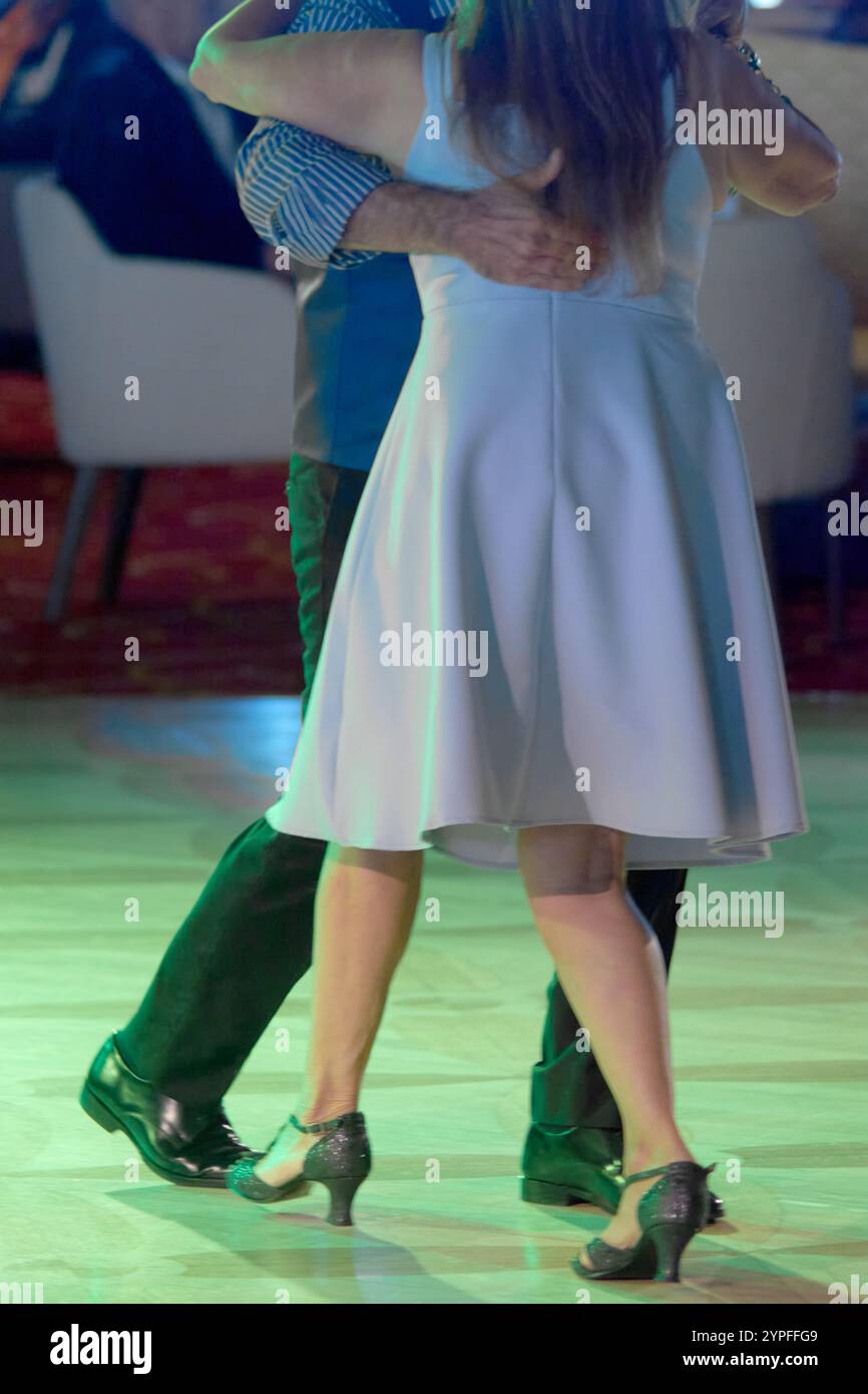 Elegant mature couple gracefully performing waltz on dance floor Stock ...