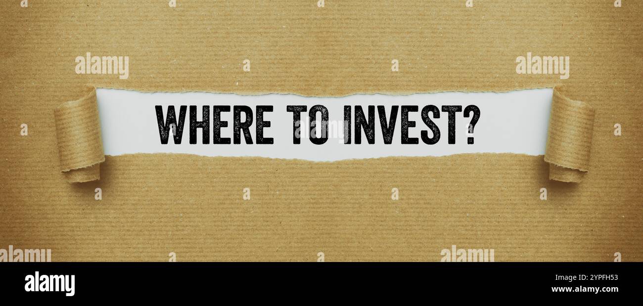Torn paper revealing the words Where to invest Stock Photo - Alamy