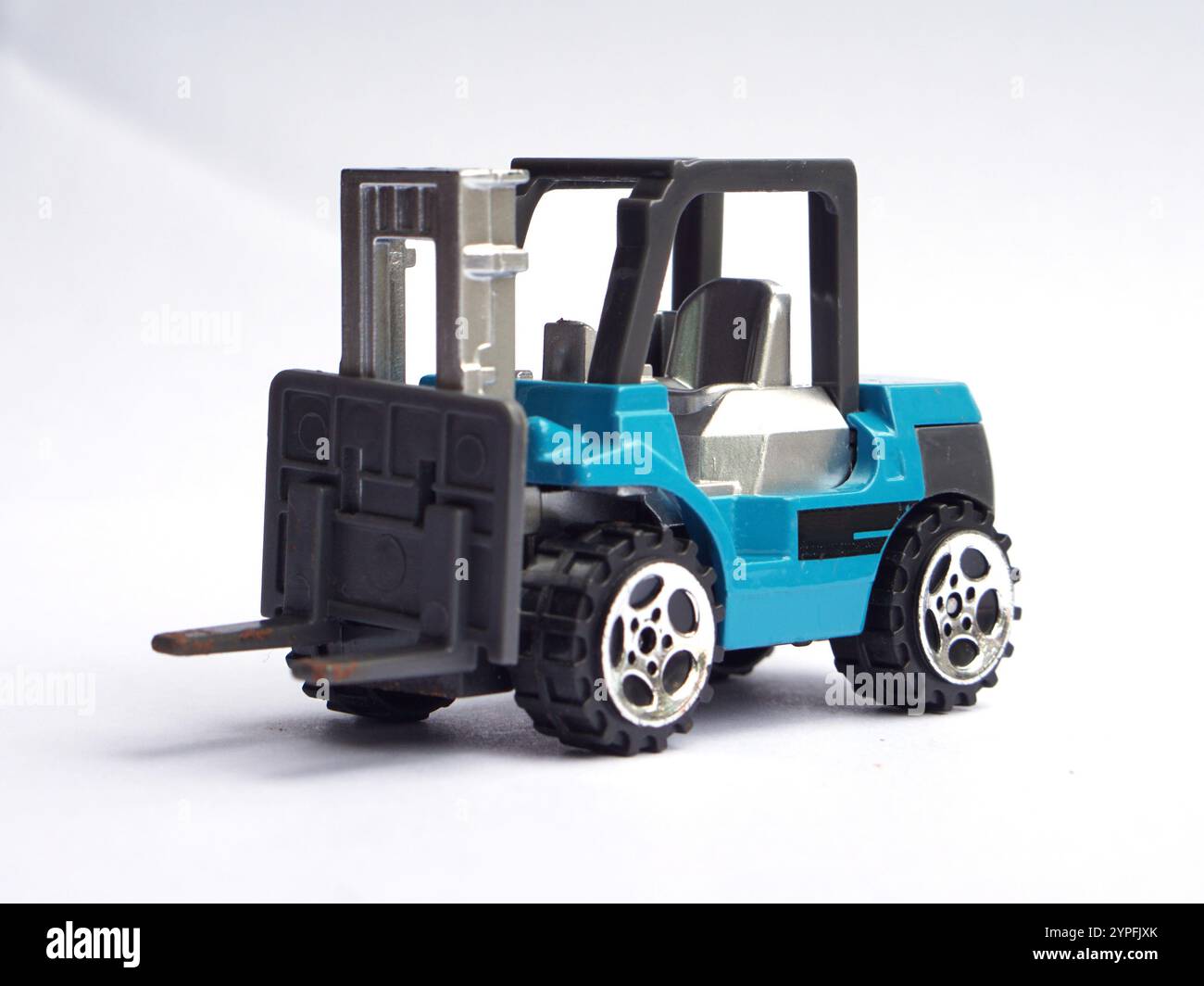 blue forklift loader toy isolated on white background. logistics and ...