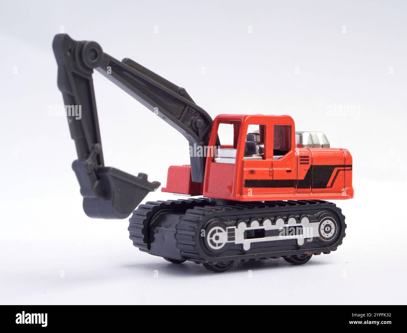 Miniature orange toy excavator hi-res stock photography and images - Alamy