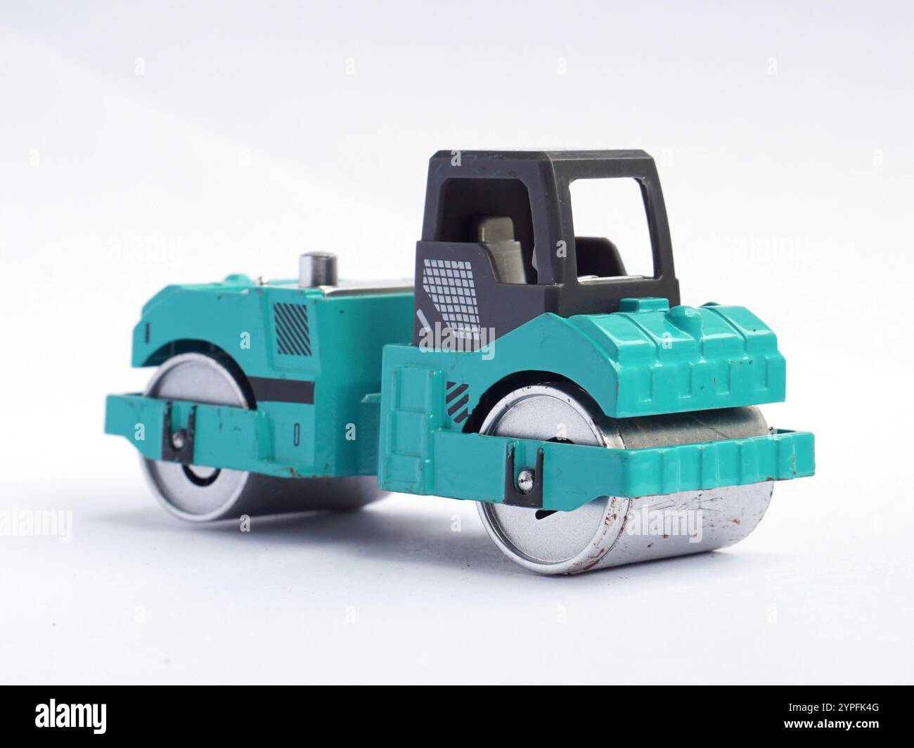 side view of road roller toy isolated on white background. heavy ...