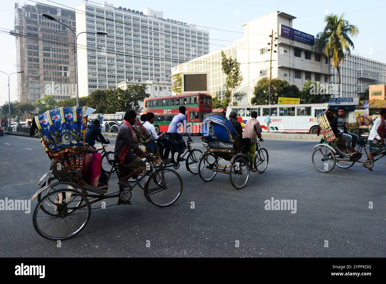Colorful cycle rickshaws roaming the streets of Dhaka, Bangladesh Stock Photo - Alamy