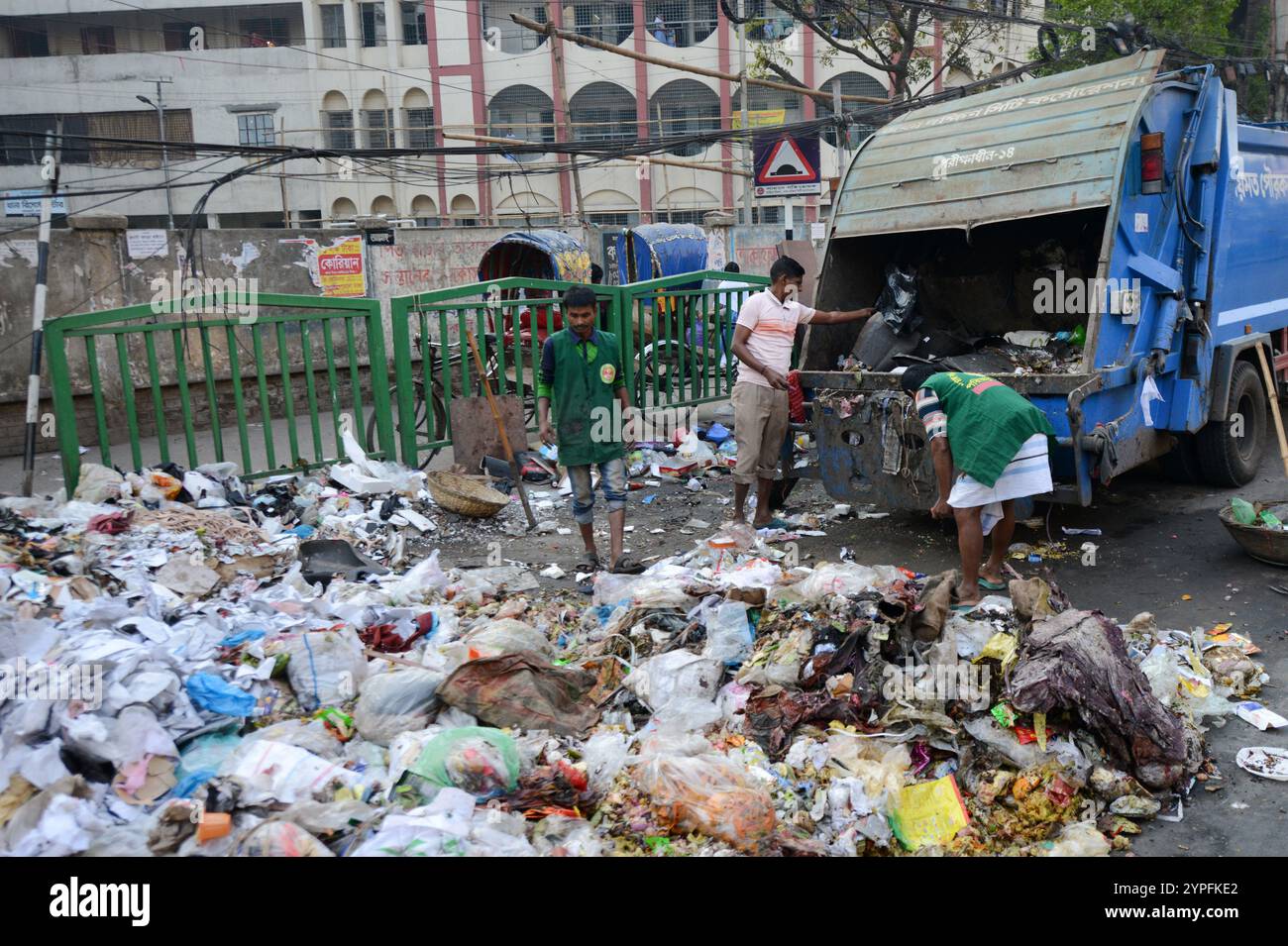Garbage collection in the early morning hours in Dhaka, Bangladesh ...