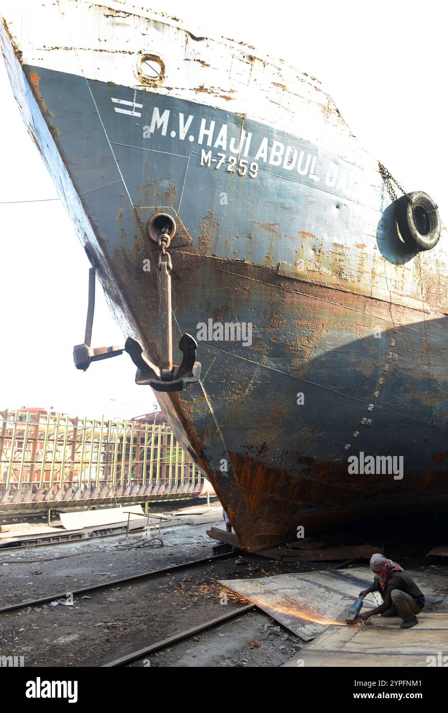 Bangladeshi men working on ships at shipyard by the Buriganga river in ...