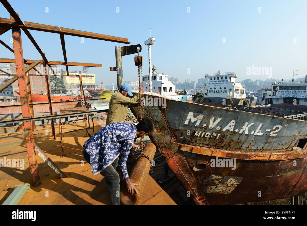 Bangladeshi men working on ships at shipyard by the Buriganga river in ...