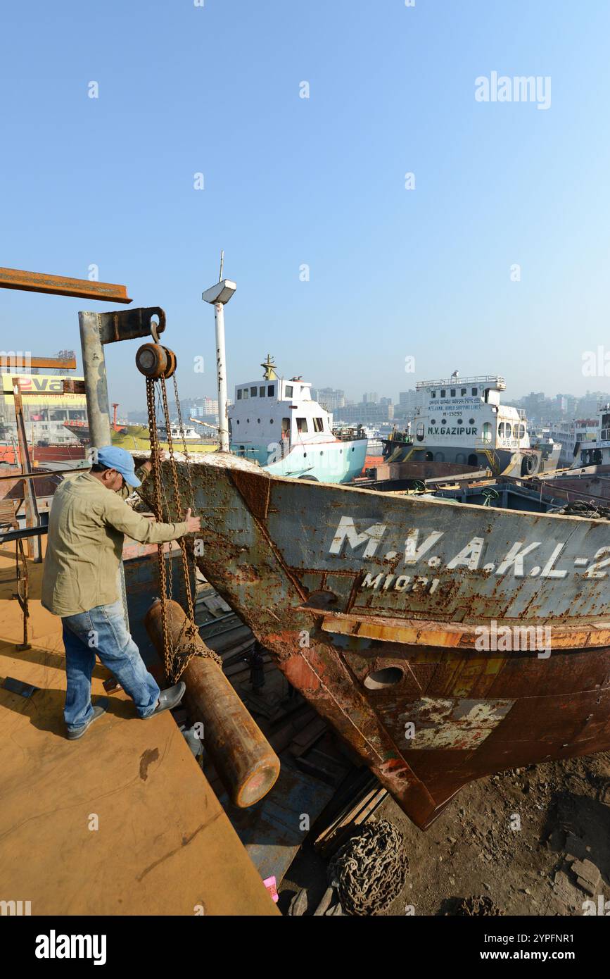 Bangladeshi men working on ships at shipyard by the Buriganga river in ...