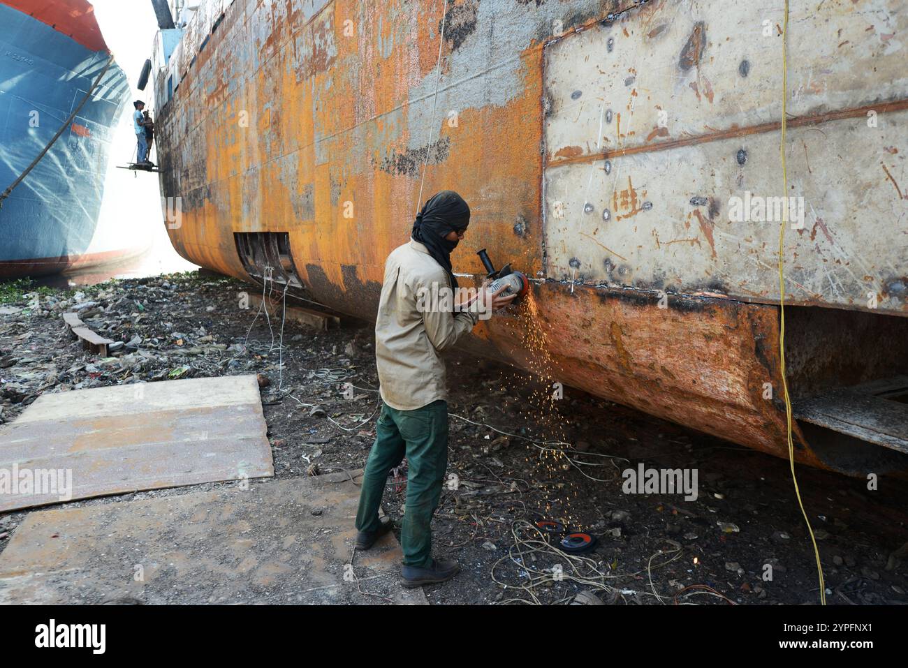 Bangladeshi men working on ships at shipyard by the Buriganga river in ...