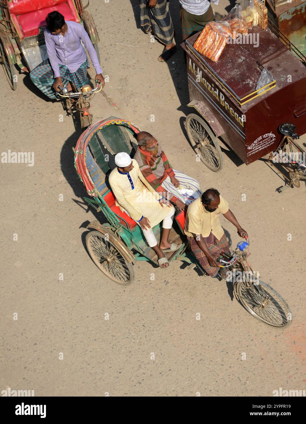Colorful cycle rickshaws roaming the streets of Dhaka, Bangladesh Stock ...