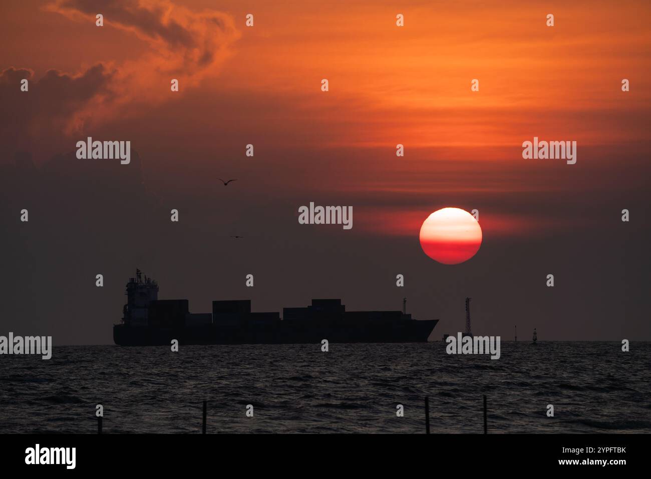 Cargo ship sailing sunset hi-res stock photography and images - Alamy