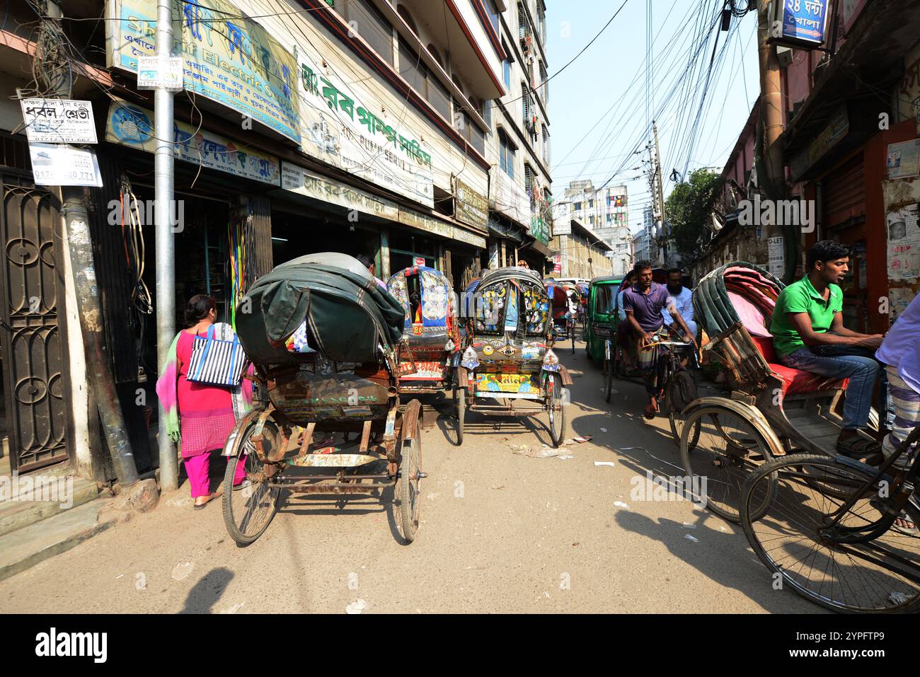 Colorful cycle rickshaws roaming the streets of Dhaka, Bangladesh Stock Photo - Alamy