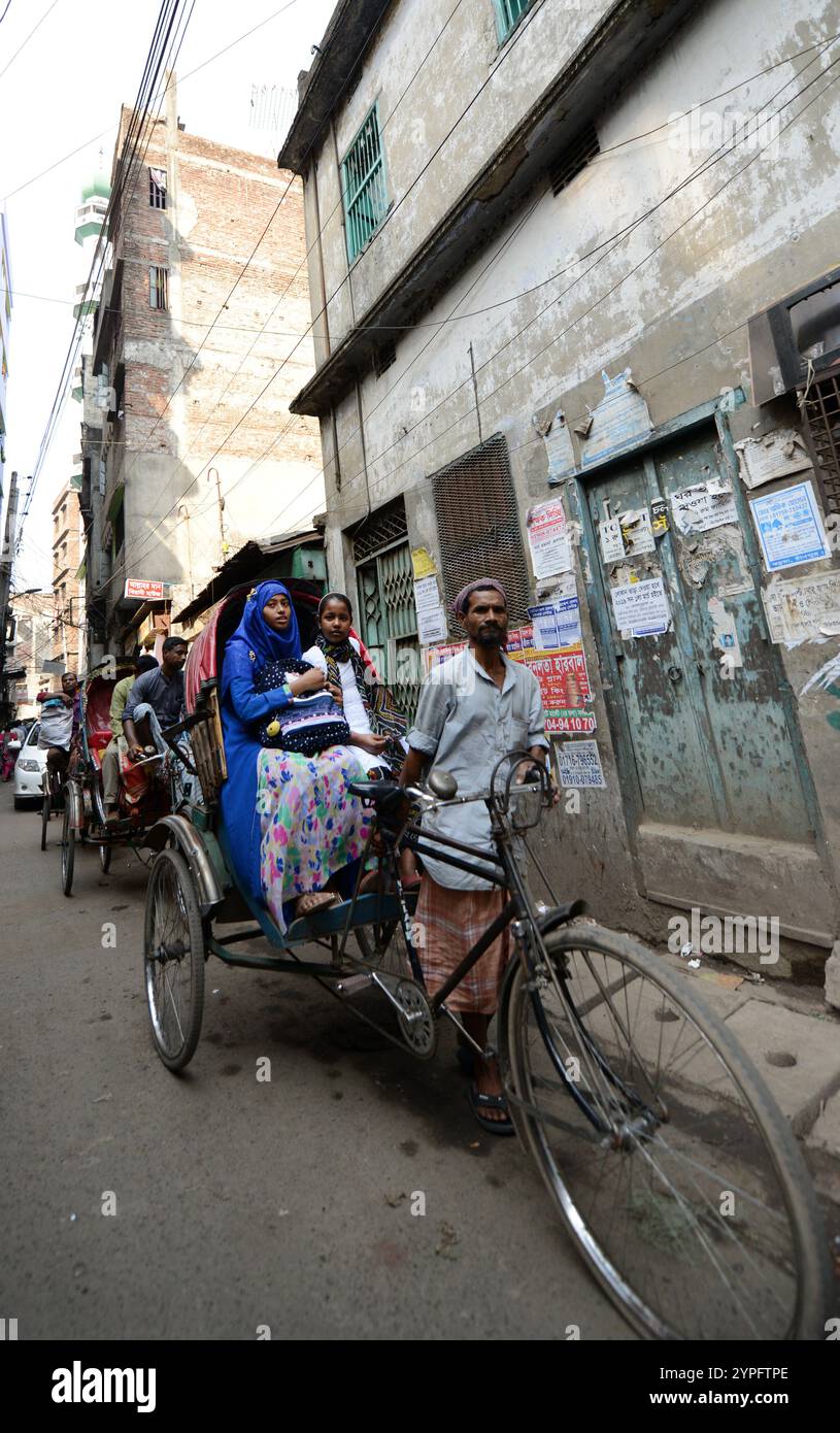 Colorful cycle rickshaws roaming the streets of Dhaka, Bangladesh Stock Photo - Alamy