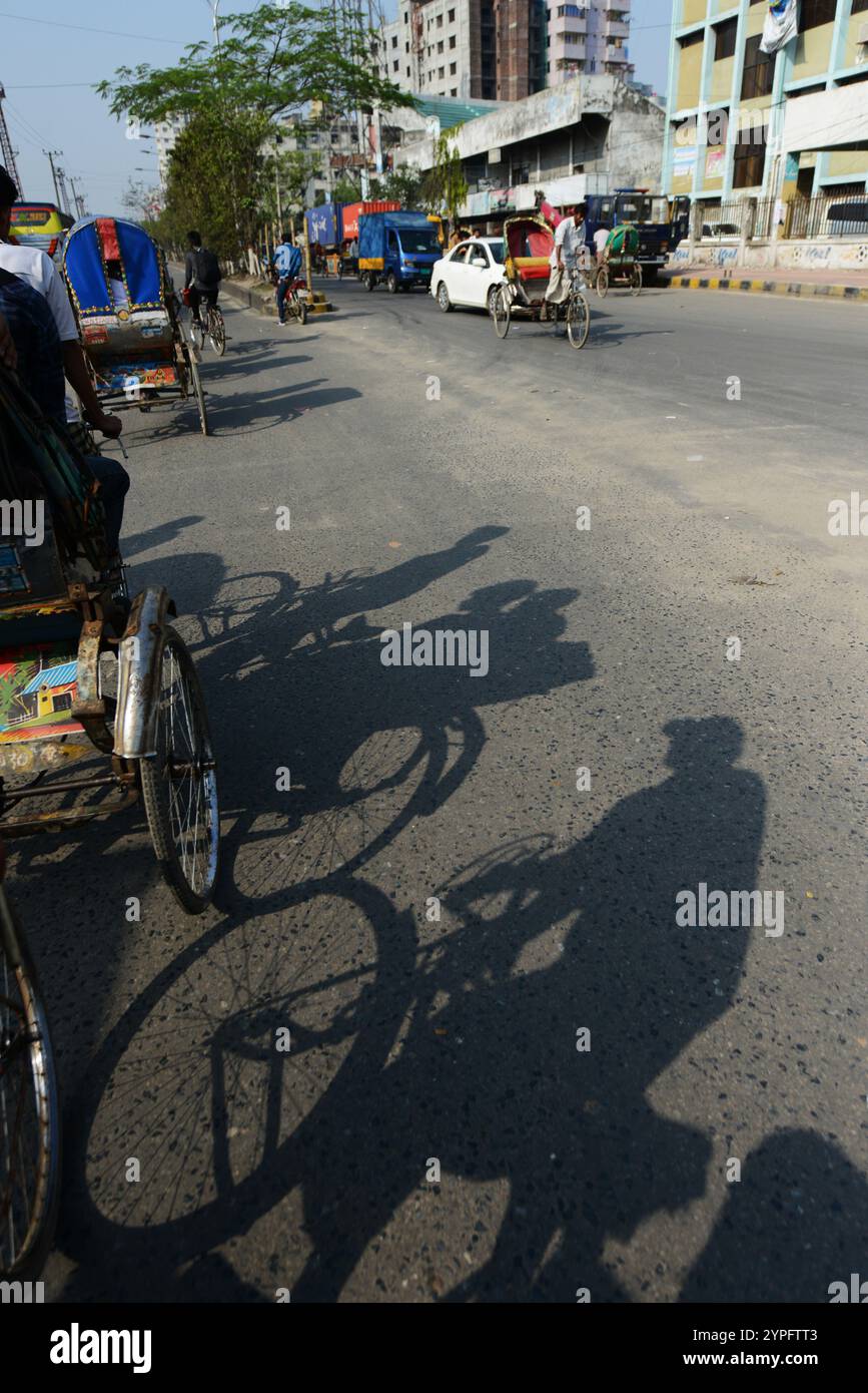 A shadow of a cycle rickshaw in Dhaka, Bangladesh Stock Photo - Alamy