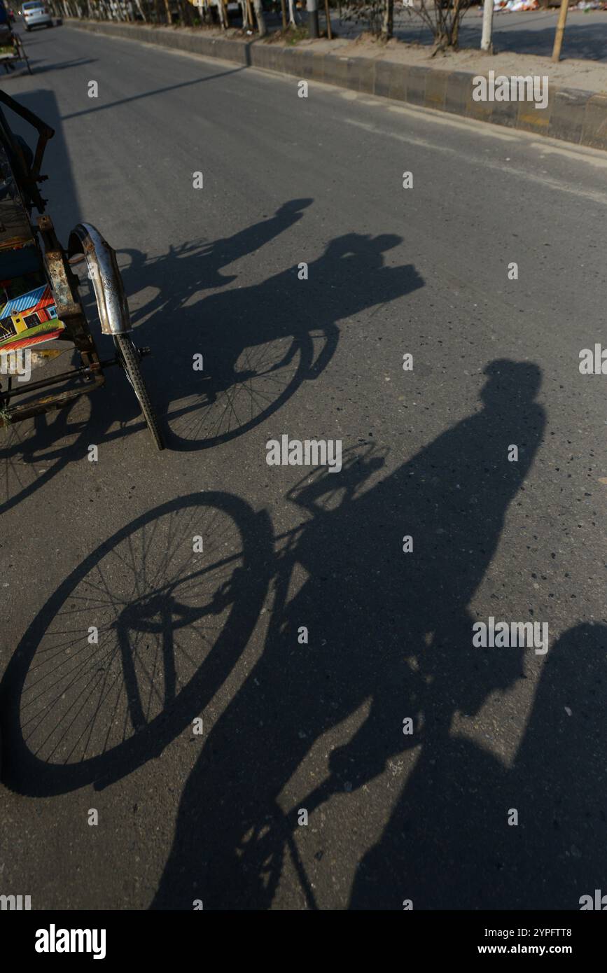 A shadow of a cycle rickshaw in Dhaka, Bangladesh Stock Photo - Alamy