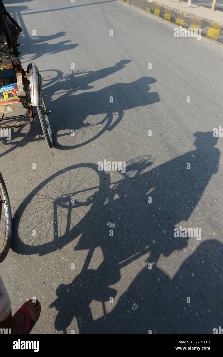A shadow of a cycle rickshaw in Dhaka, Bangladesh Stock Photo - Alamy