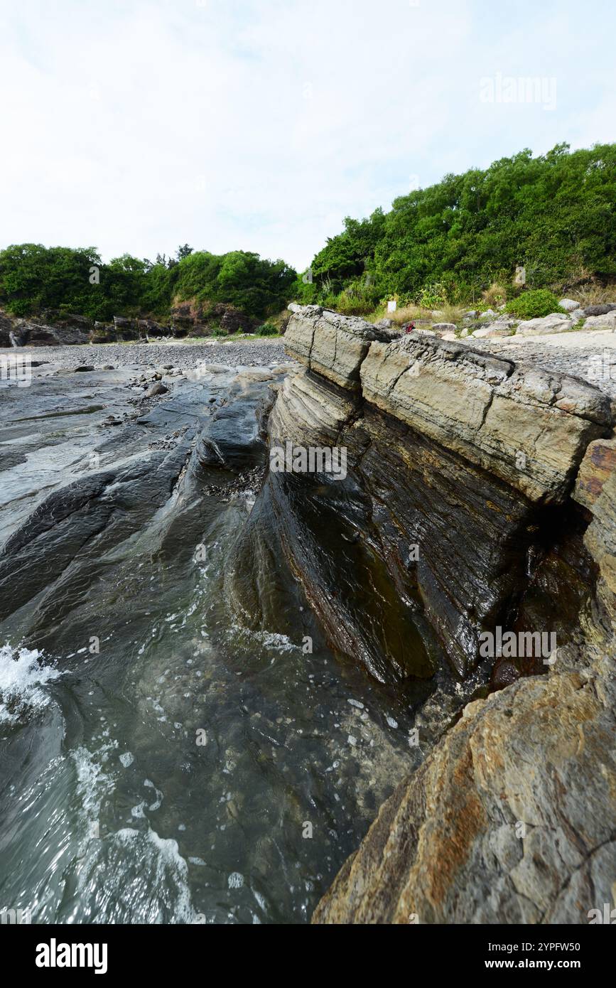 Beautiful rock formation on the beach in the western coast of Tung Ping ...