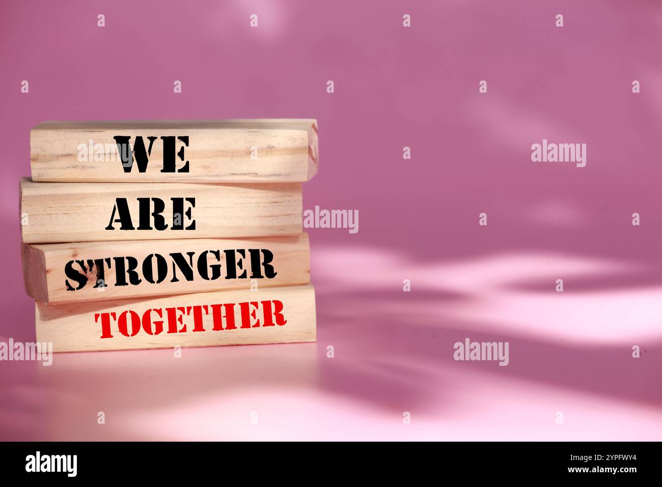 We are stronger together symbol. Wooden blocks with words We are ...