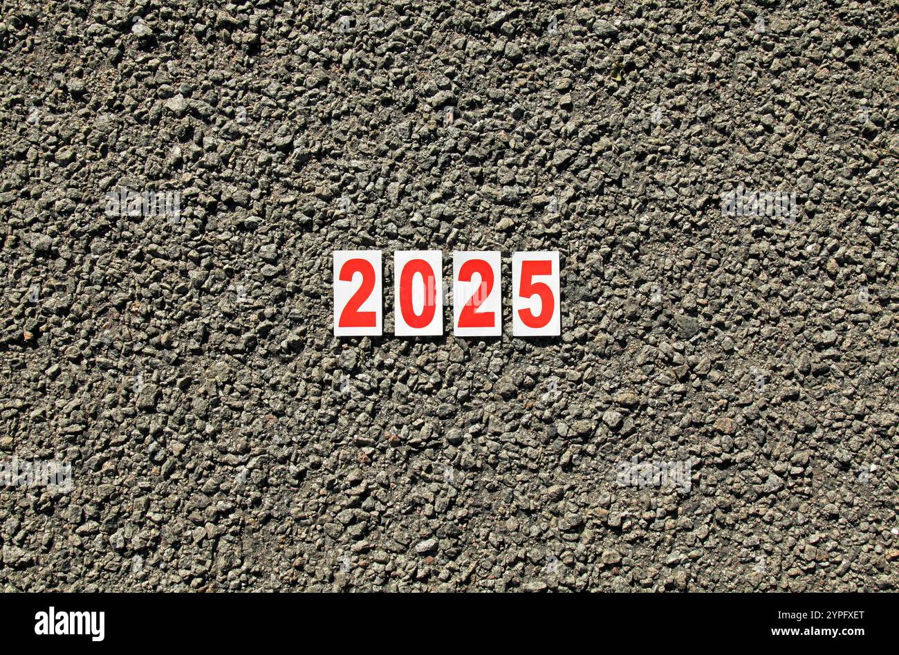Numbers of 2025 year. Paper square numbers on the stone road background ...