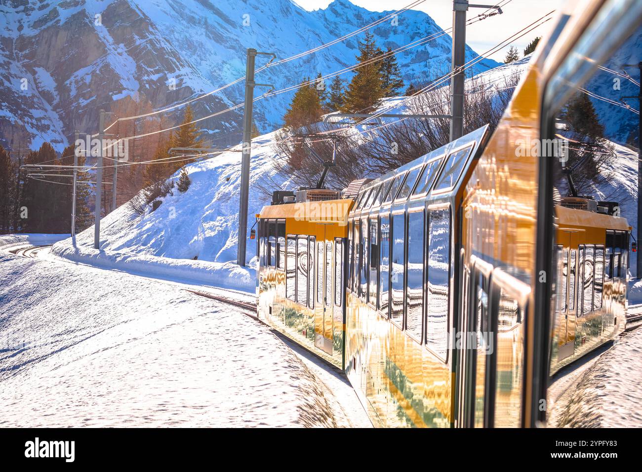 Wengen railway to Jungfraujoch peak train in winter landscape view ...