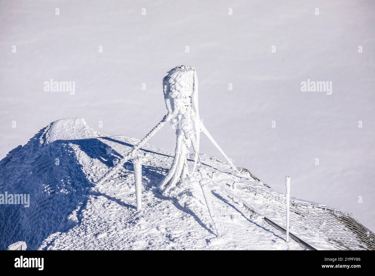 Weather station antenna bound by ice on Jungfraujoch peak in Swiss Alps ...