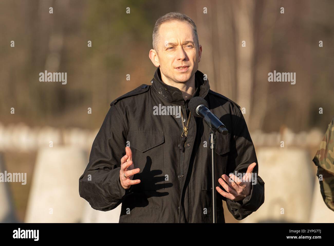 Cezary Tomczyk, Secretary of State gestures as he speaks to the media ...