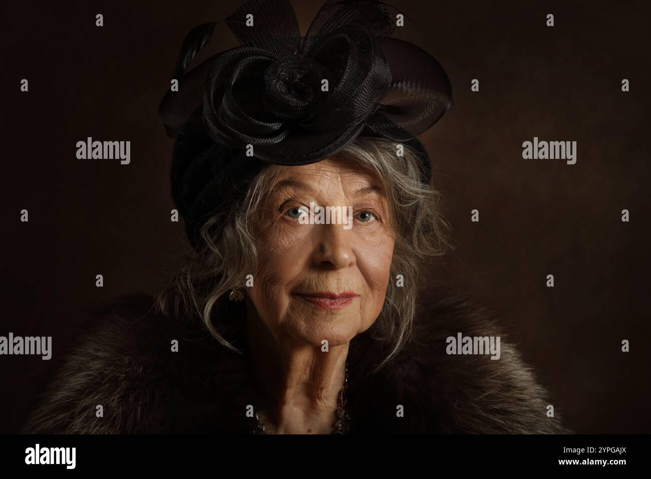 Portrait of an old lady in vintage clothes on a brown background Stock ...
