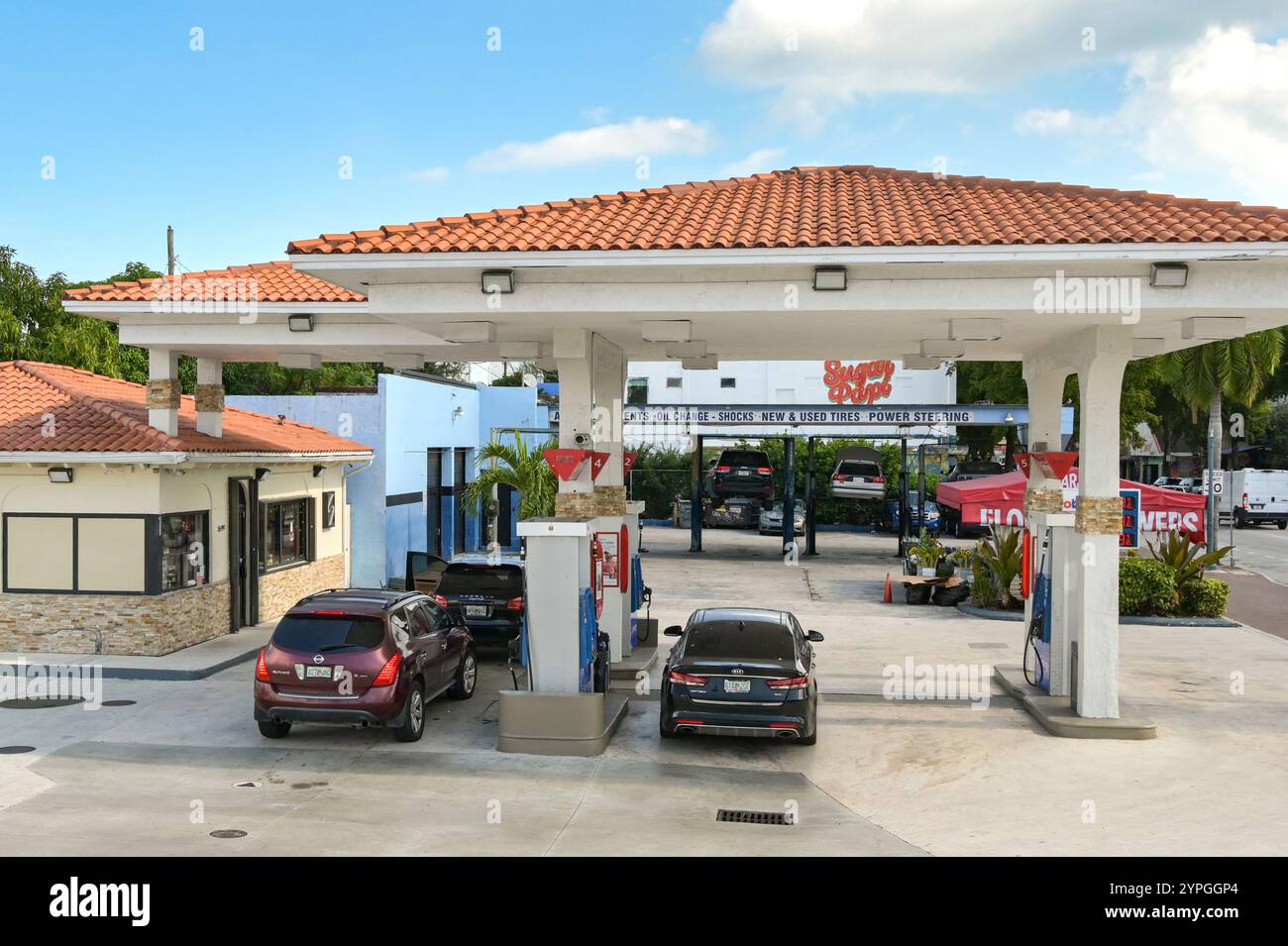 Miami, Florida, USA - 3 December 2023: Cars in a gas station in the ...