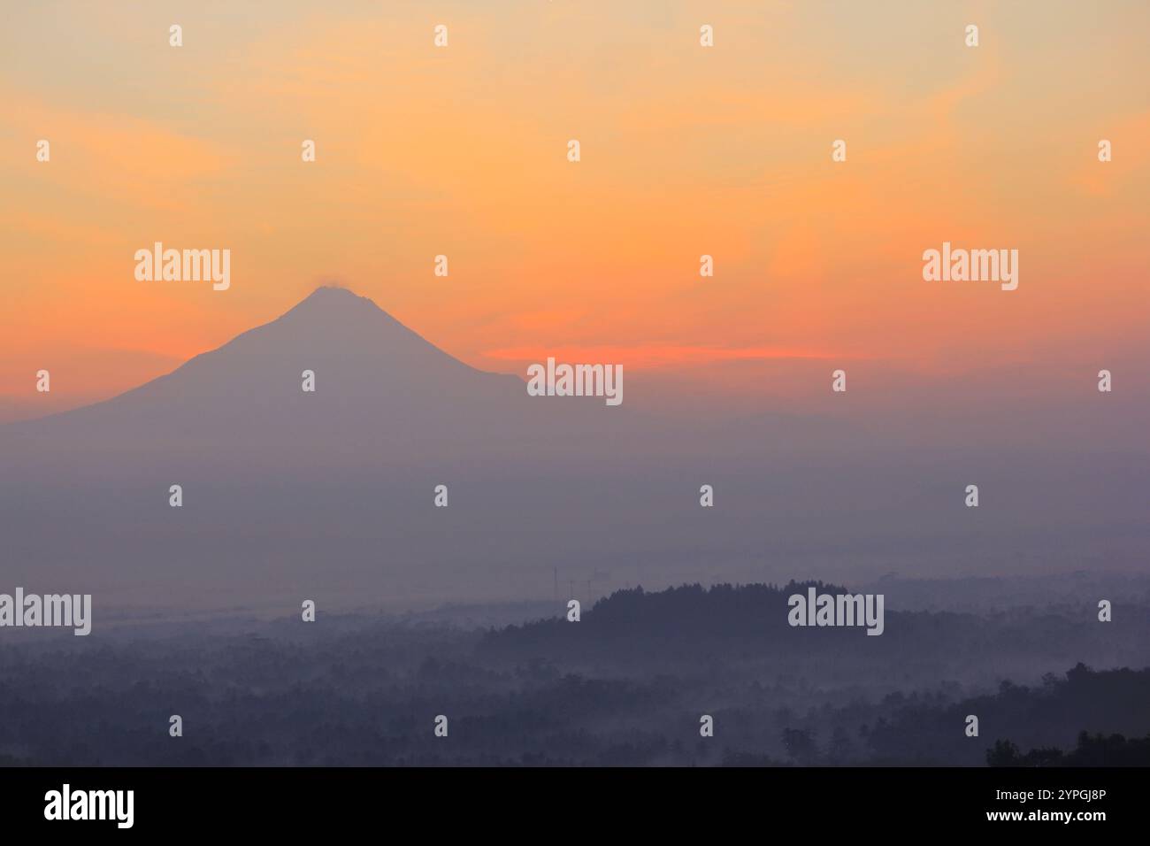 Silhouette of Mount Merapi with a red-orange sky at sunrise Stock Photo ...