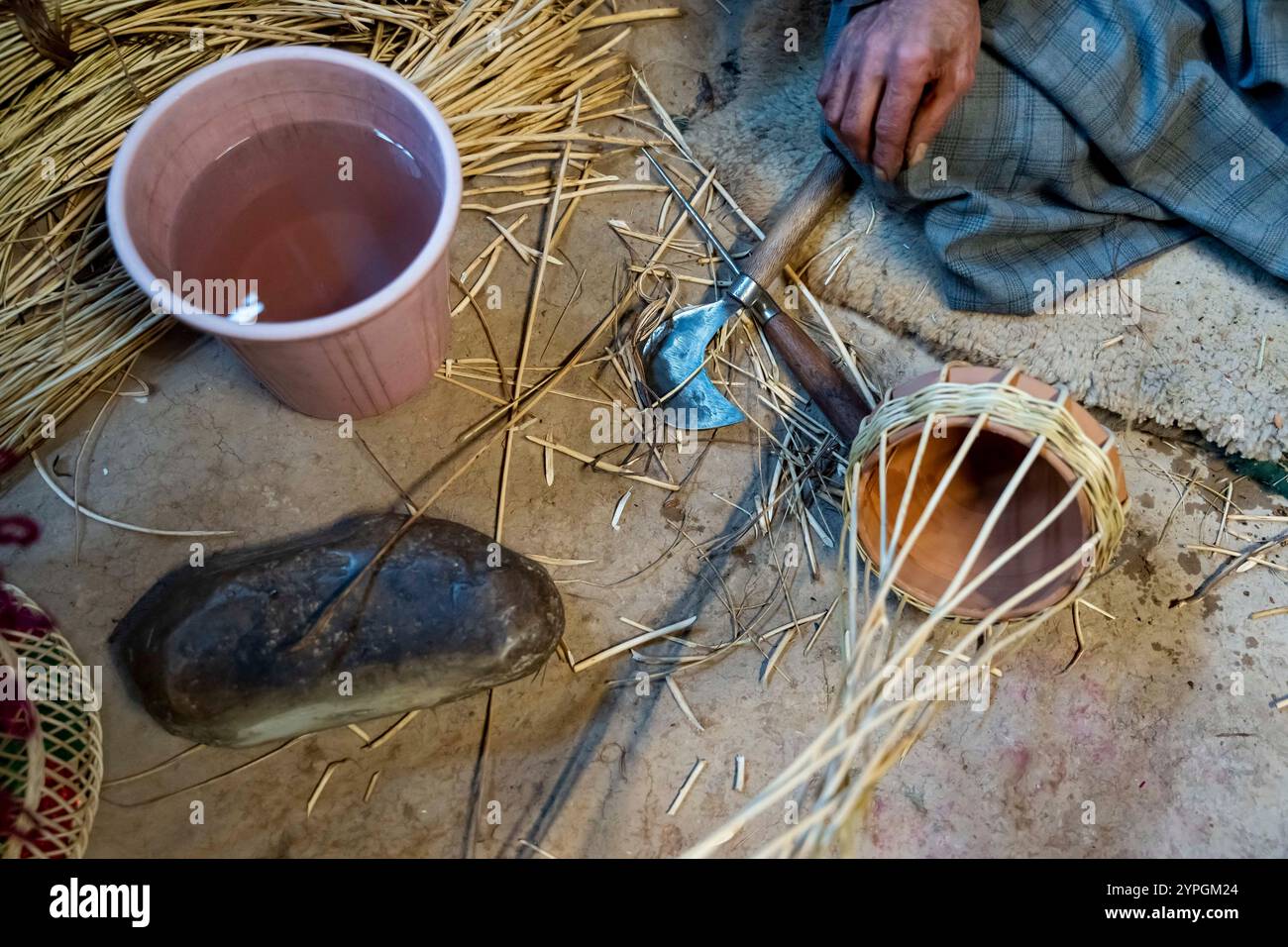 Tools used in kangri making are seen in front of an artisan at his home ...
