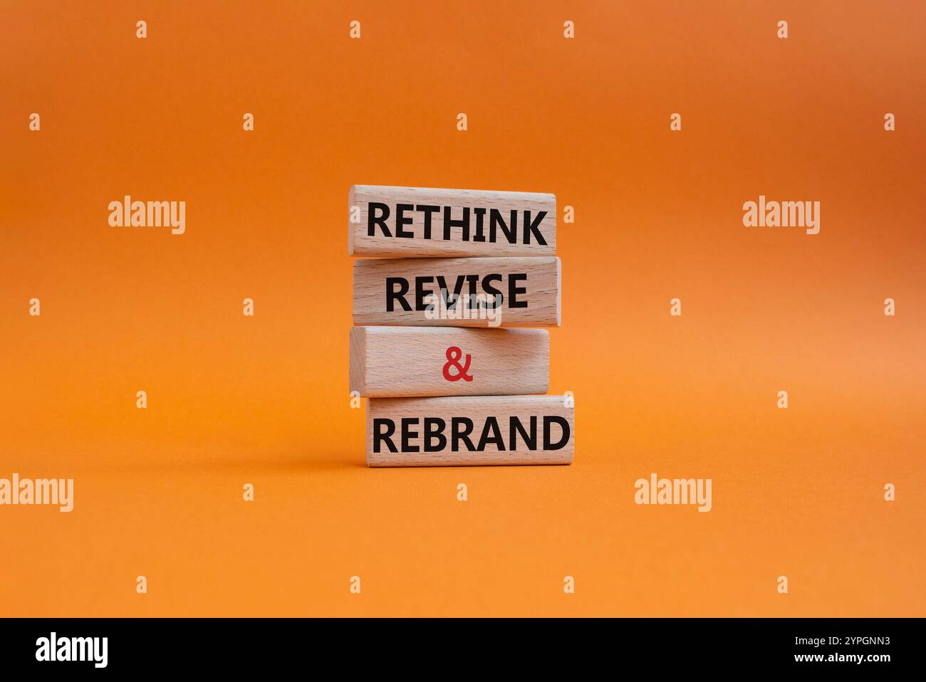Rethink Revise and Rebrand symbol. Wooden blocks with words Rethink Revise and Rebrand ...
