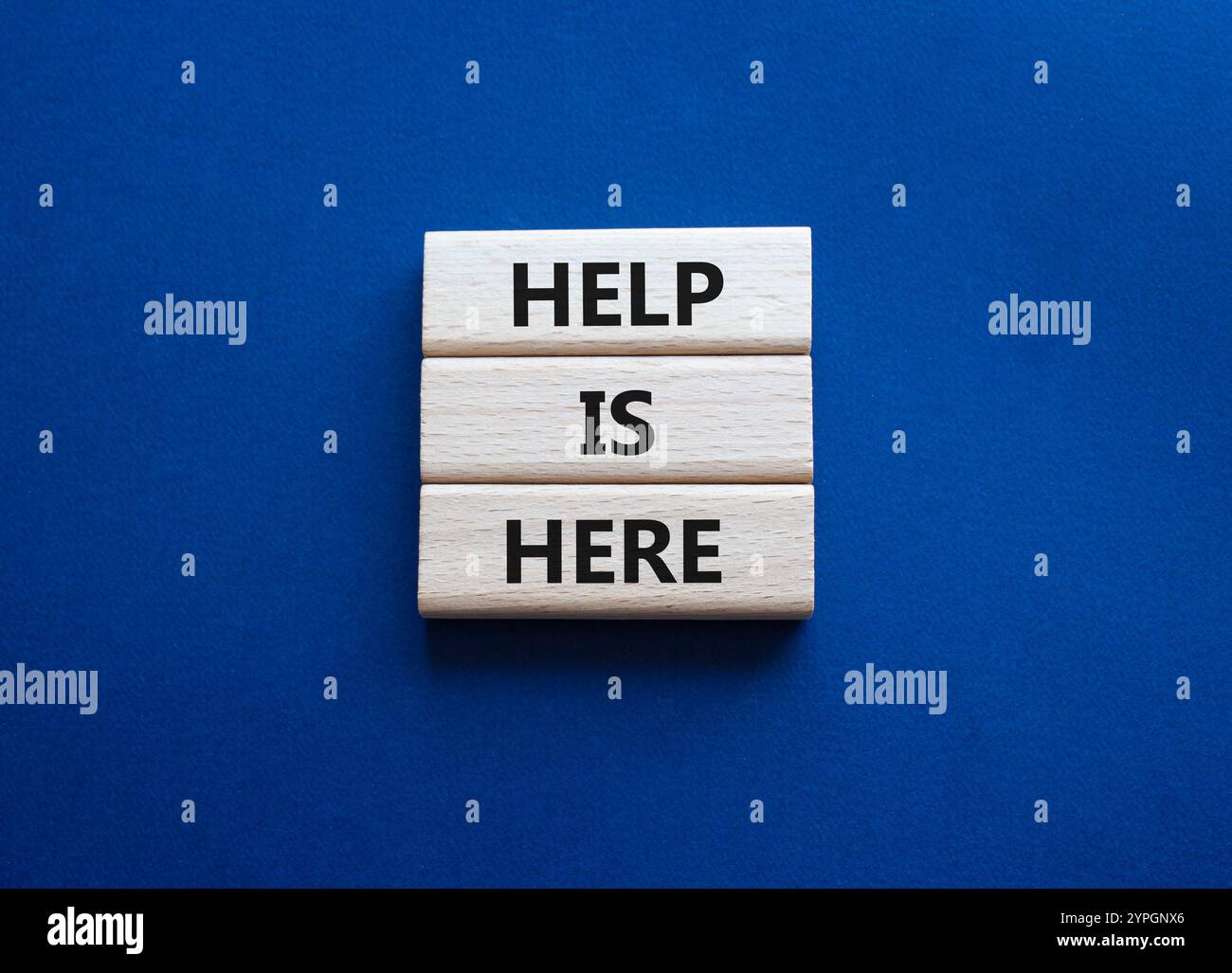 Help is here symbol. Wooden blocks with words Help is here. Beautiful ...
