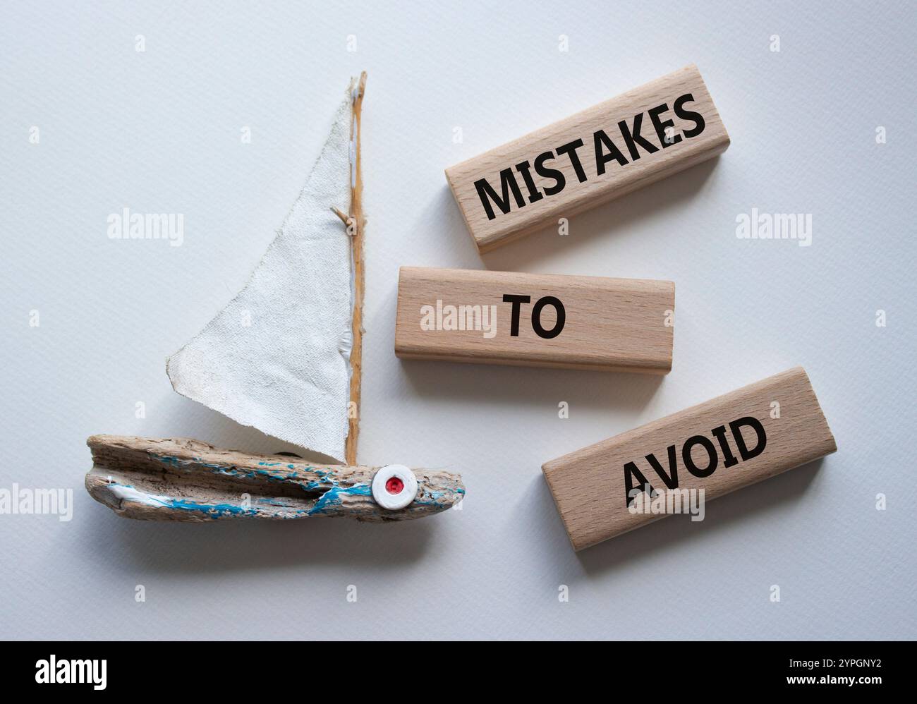 Mistakes to Avoid symbol. Wooden blocks with words Mistakes to Avoid ...