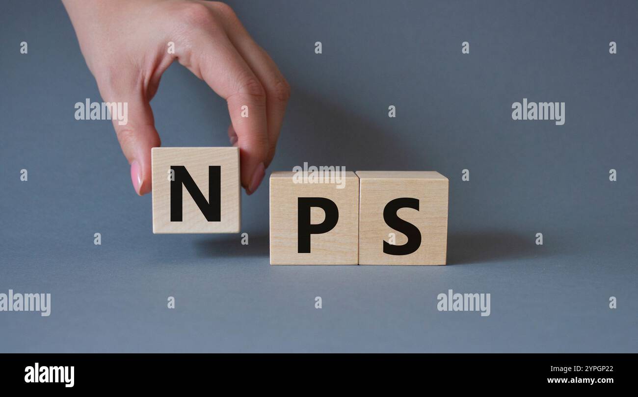 NPS - Net Promoter Score symbol. Wooden cubes with words NPS ...