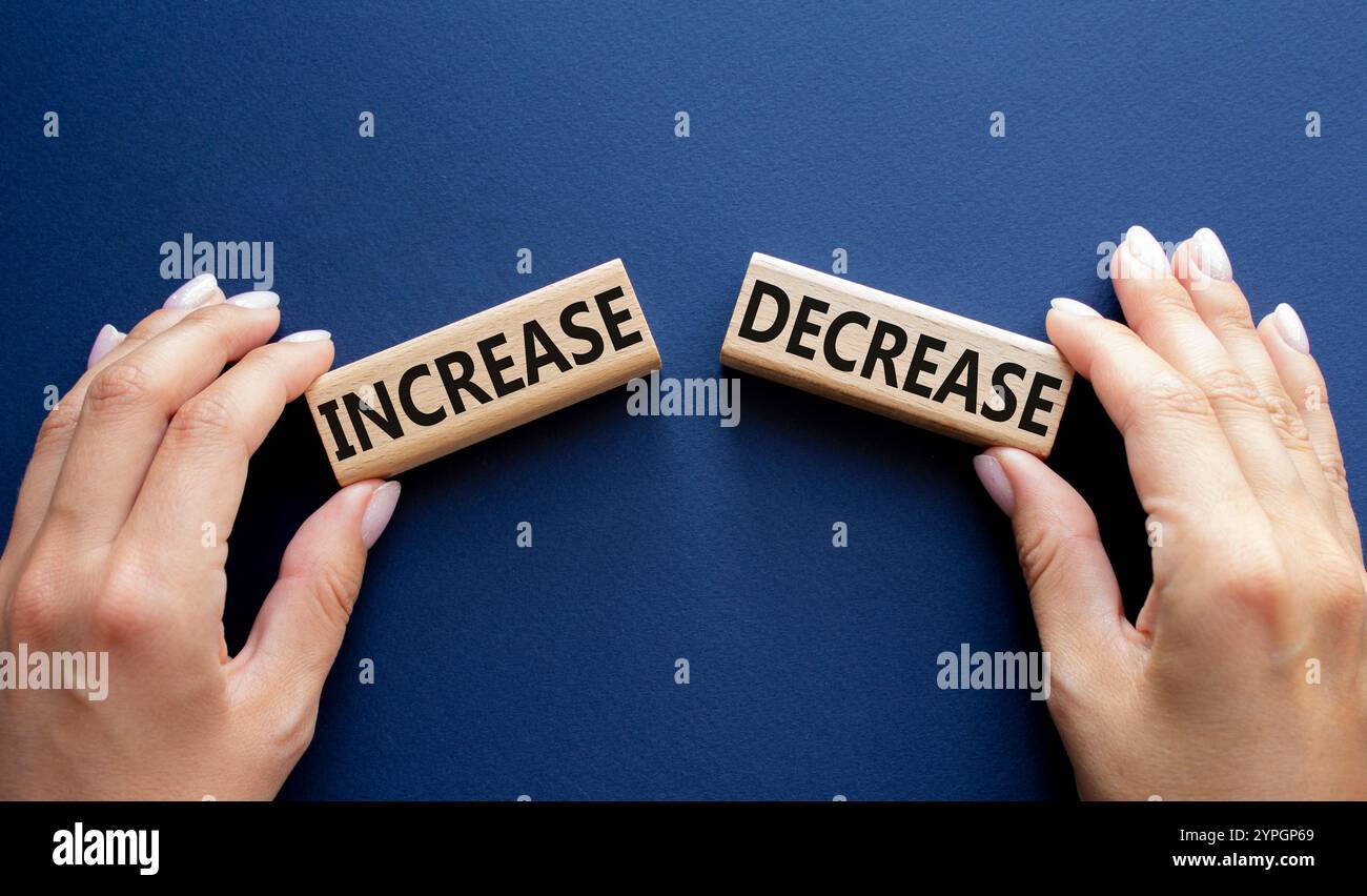 Increase or Decrease symbol. Concept word Increase or Decrease on wooden blocks. Businessman ...
