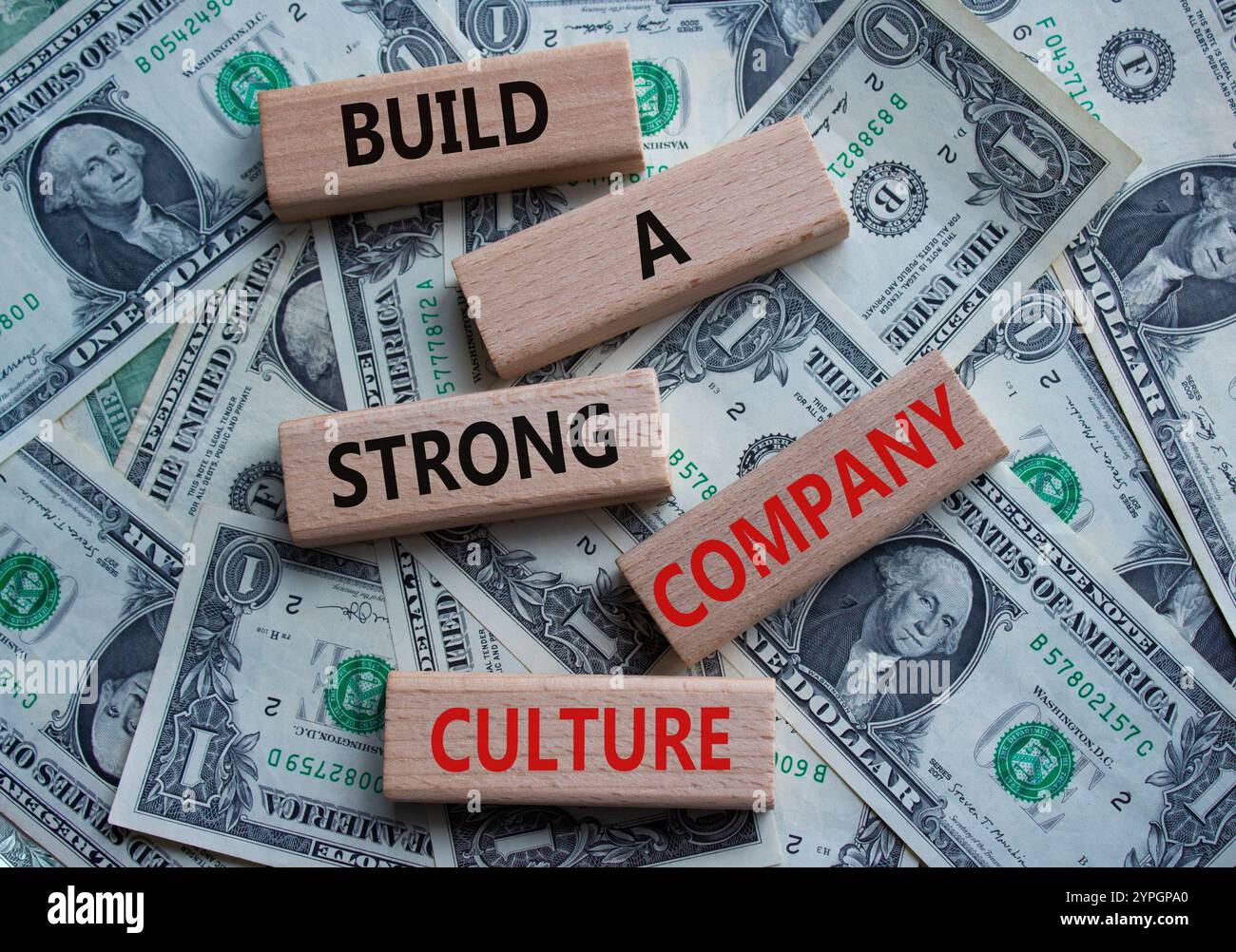 Company culture symbol. Wooden blocks with words Build a strong company ...