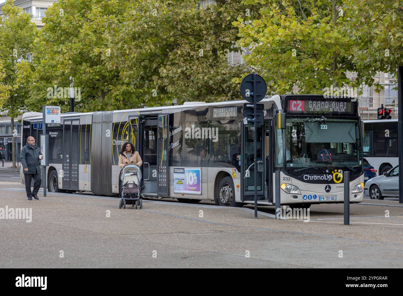 Passengers Leaving A Public City Bus In The Downtown City Centre Of Le ...