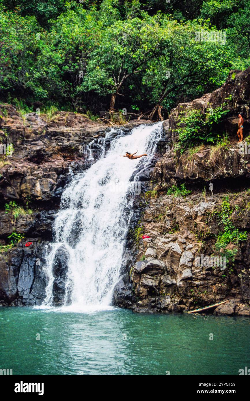 Cliff diving exhibition at Waimea Waterfall in Waimea Falls Park, Oahu ...