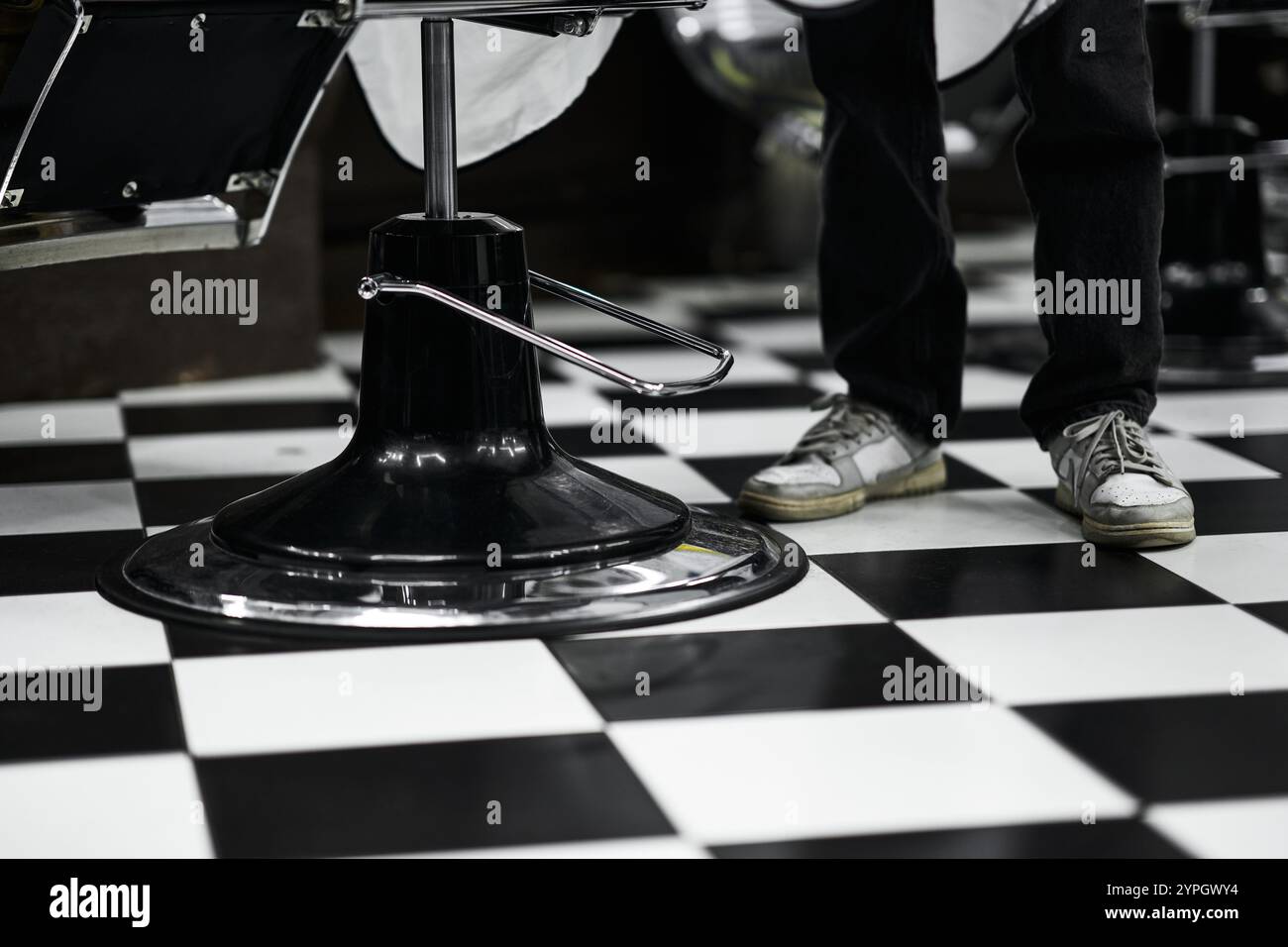 Modern barber shop interior with black and white checkerboard flooring ...