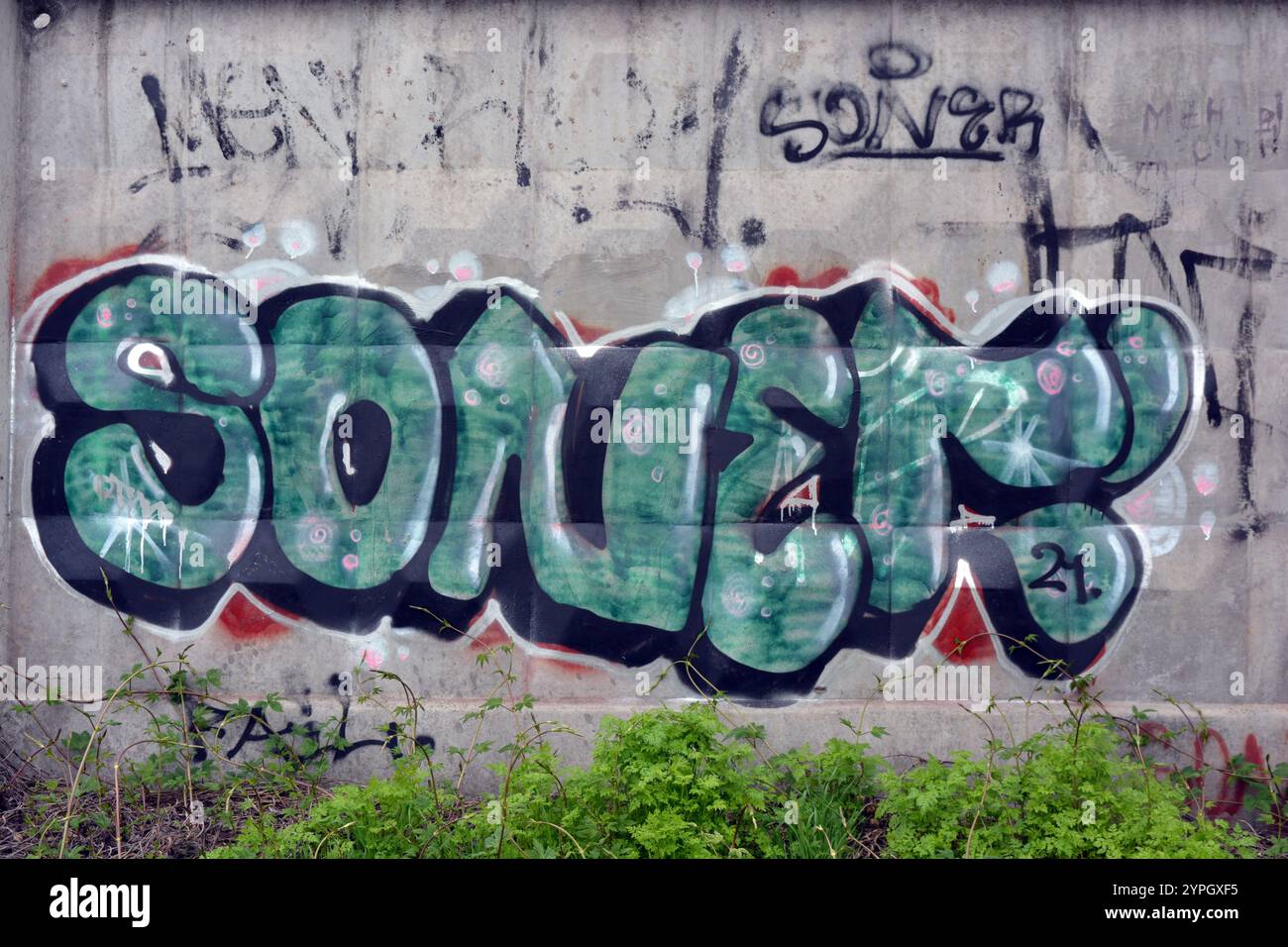 Green letters and white lines with thick black borders. A drawing ...