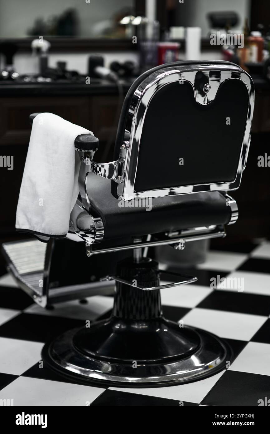 Retro barber chair in a stylish black and white barbershop interior ...